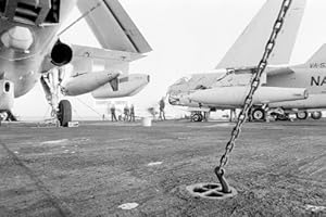 Amazon.com: Photo Two flight deck crewmen use tie-down chains to secure ...